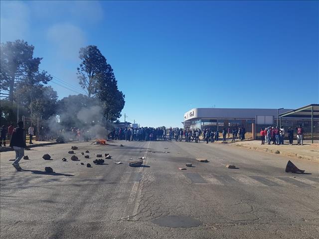 #BreakingNews: Protesters torching Ottosdal buildings | OFM
